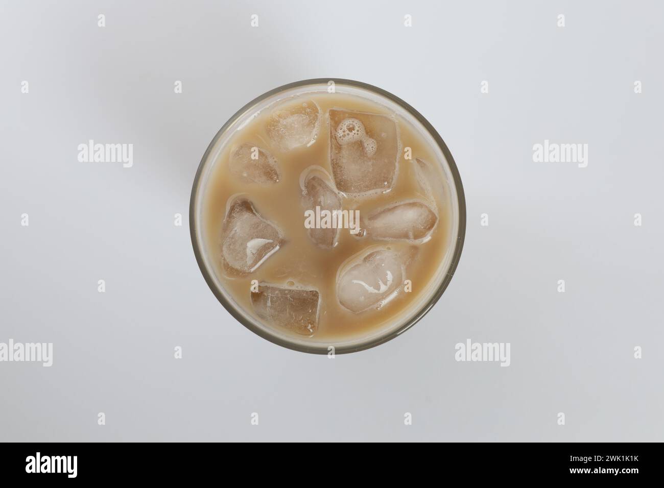 Iced coffee in glass on white background, top view Stock Photo - Alamy