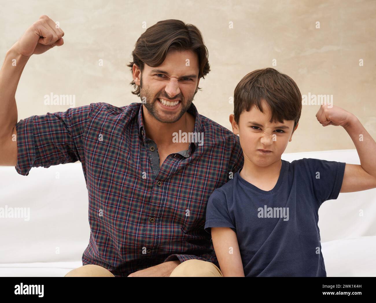 Sofa, muscle and portrait of father and child flex for bonding, fun ...