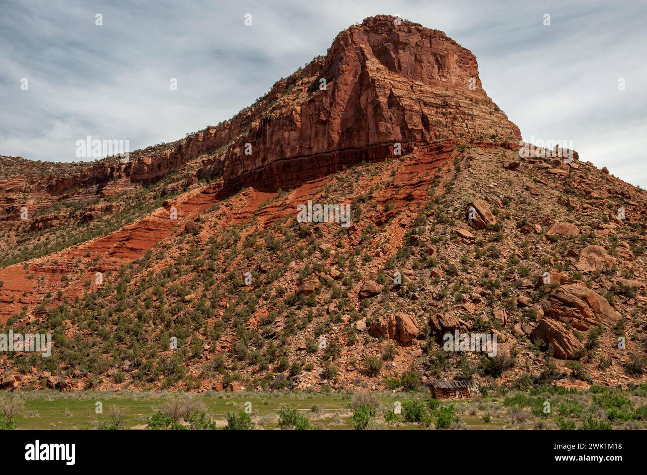 A red cliff above an old cowboy cabin near Gateway, Colorado Stock ...