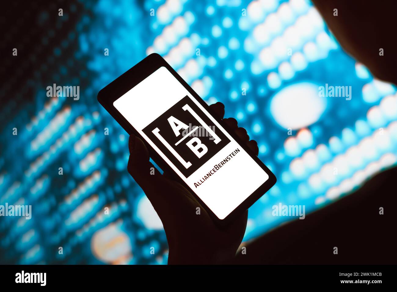 In this photo illustration, the AllianceBernstein (AB) logo is ...