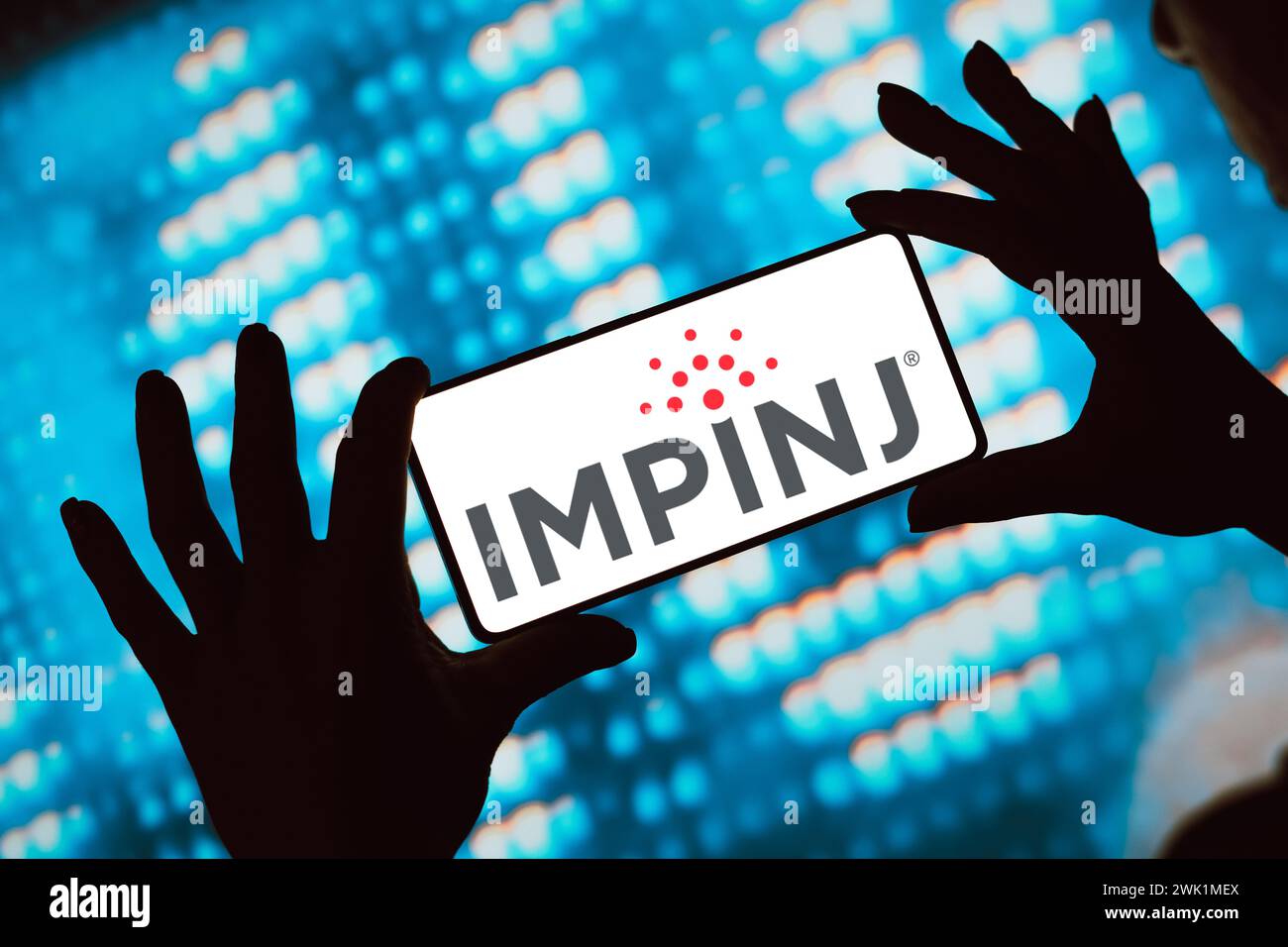 In this photo illustration, the Impinj, Inc. logo is displayed on a ...