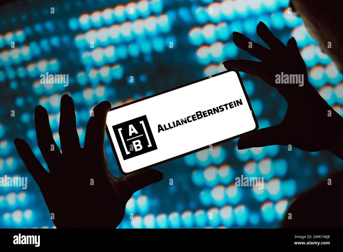 In this photo illustration, the AllianceBernstein (AB) logo is ...
