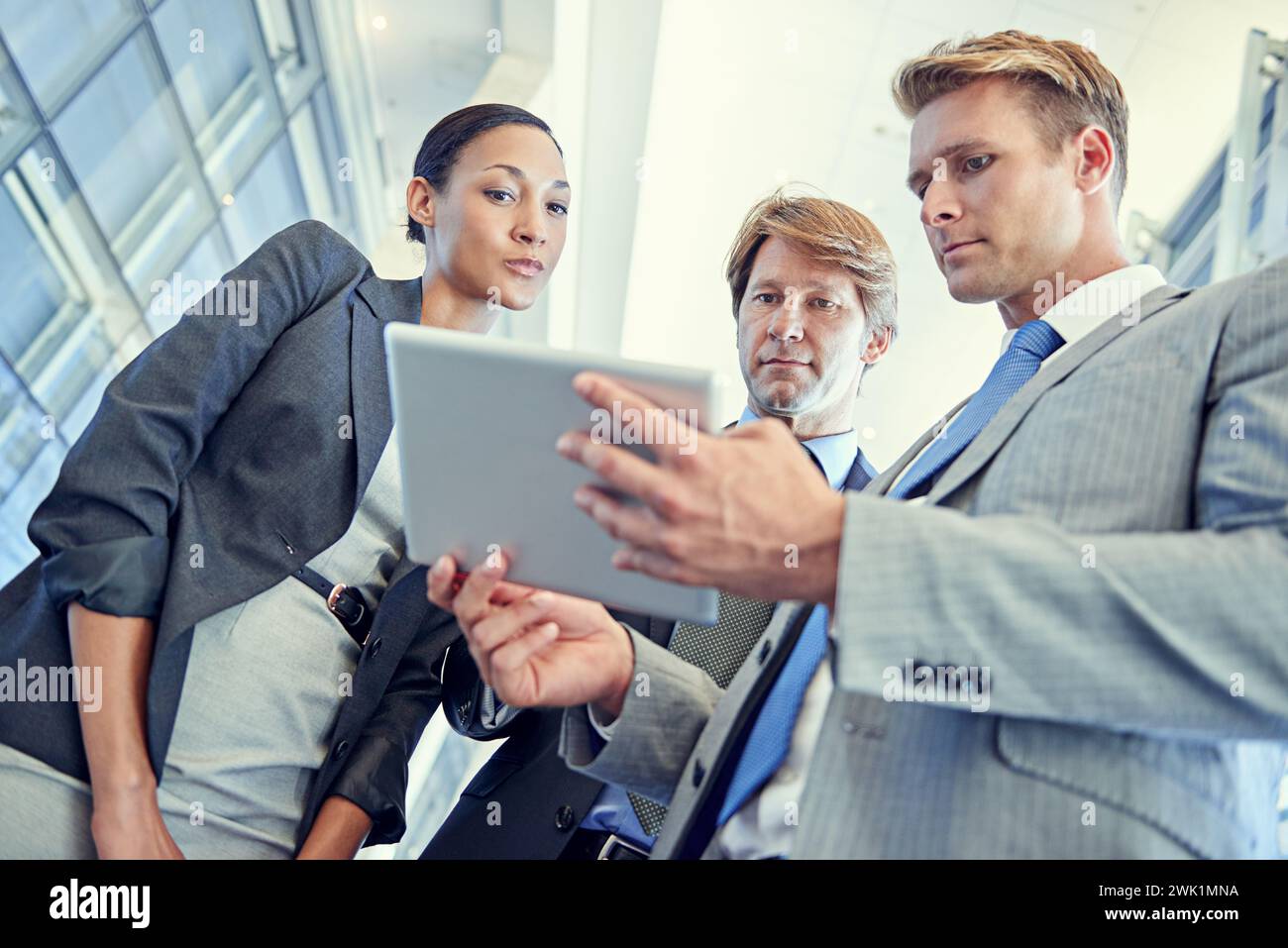 Business people, tablet and discussion for project in office ...