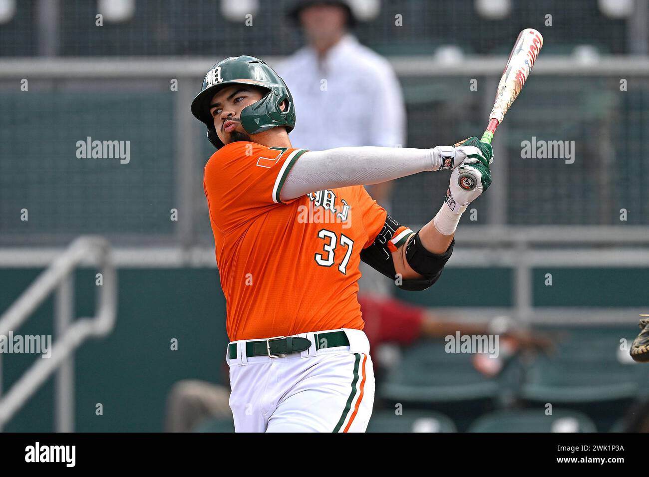 CORAL GABLES, FL - FEBRUARY 17: Miami infielder Jason Torres (37) hits ...