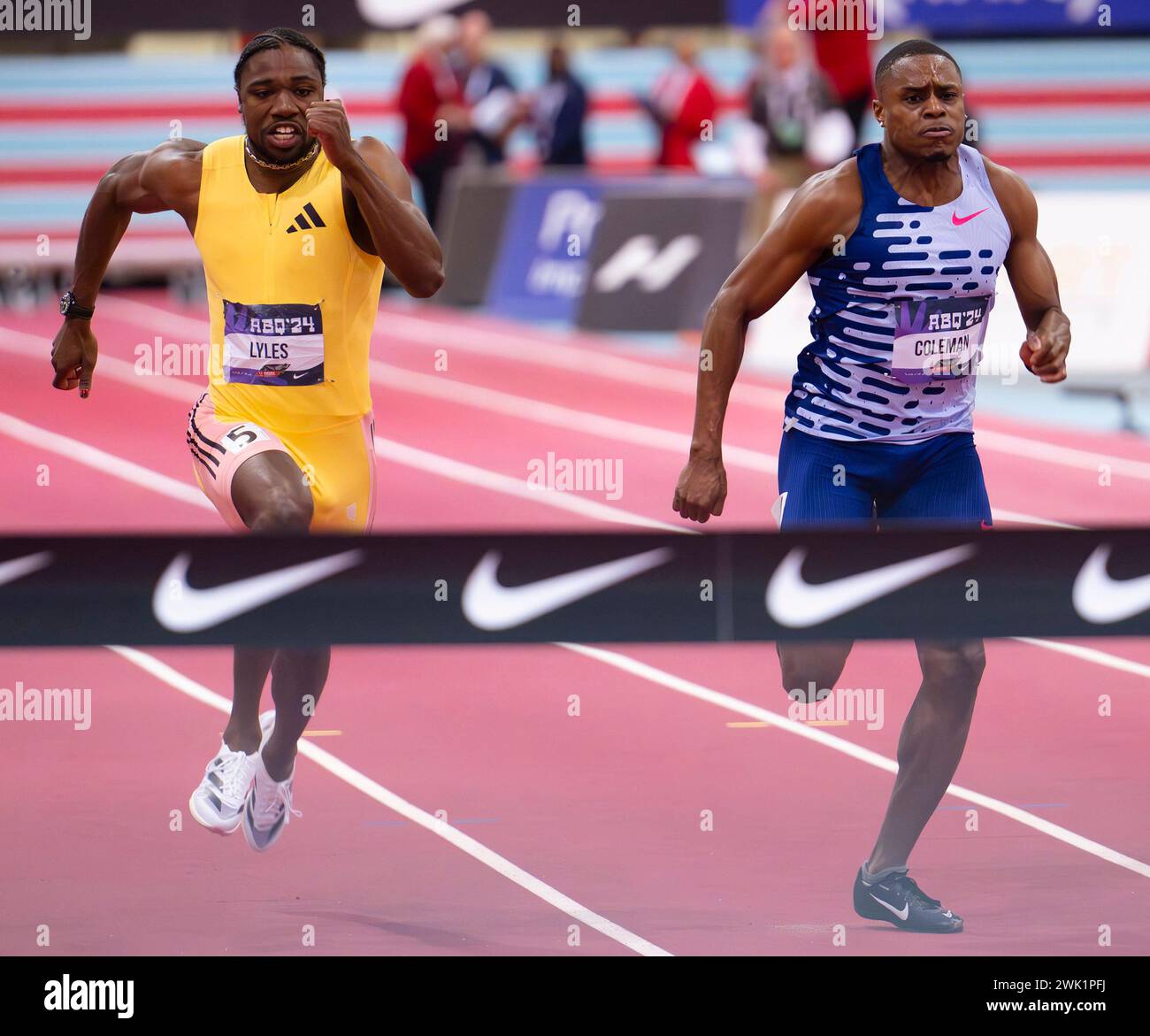 Noah Lyles, left, pushes toward the finish line next to Christian ...