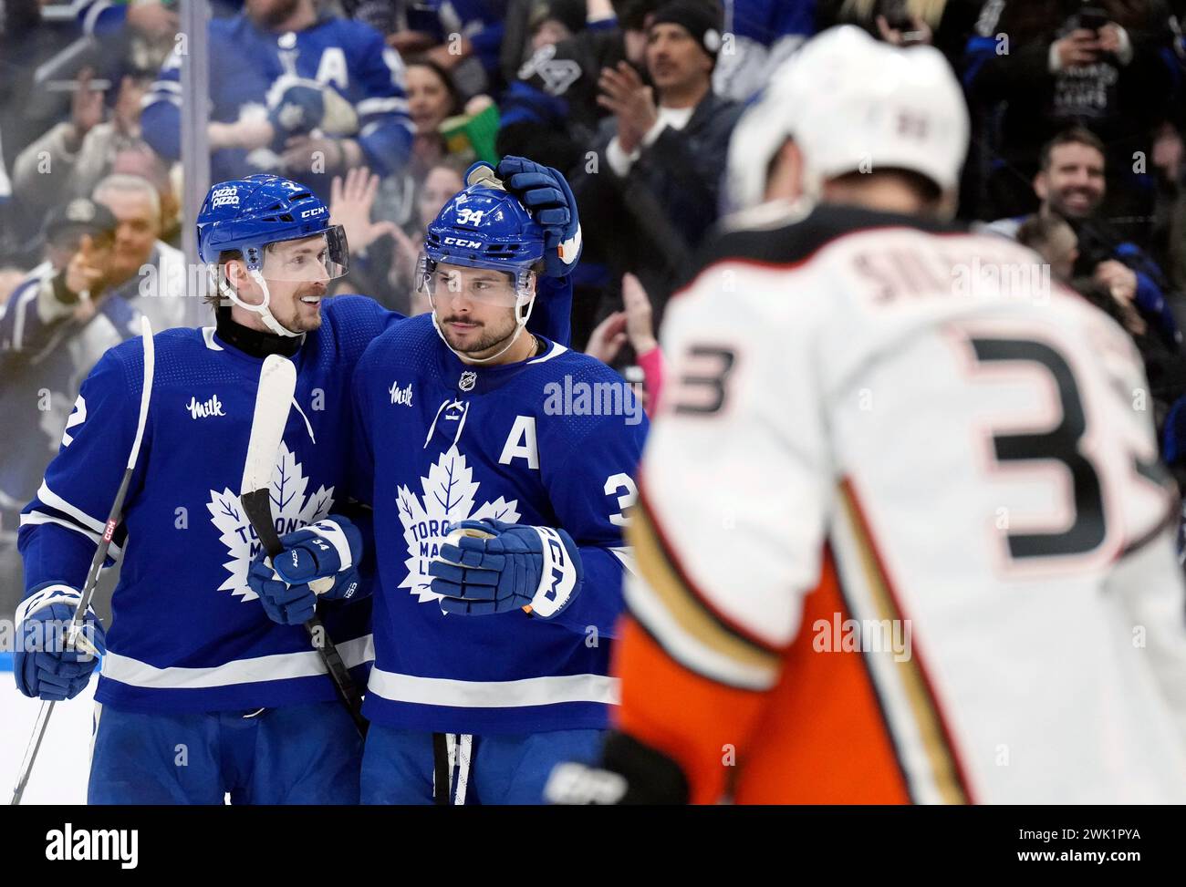 Toronto Maple Leafs' Auston Matthews, center, is congratulated by Simon ...