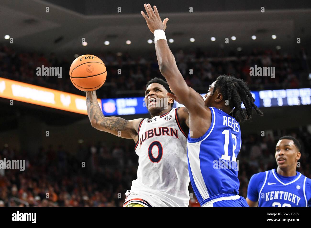 Auburn guard K.D. Johnson (0) shoots against Kentucky guard Antonio ... Auburn guard K.D. Johnson (0) shoots against Kentucky guard Antonio ...