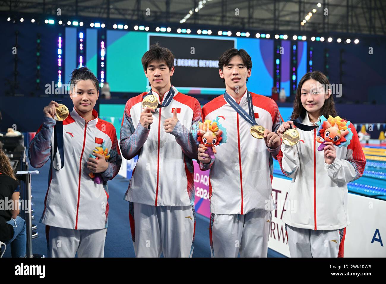 Doha, Qatar. 17th Feb, 2024. Gold medalists Yu Yiting, Pan Zhanle, Wang ...