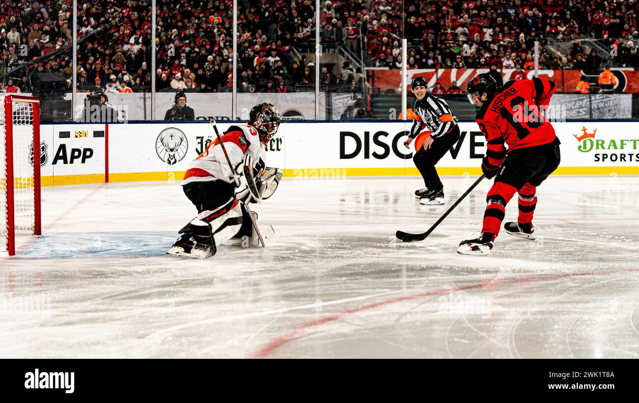 New Jersey Devils center Nico Hischier (13) shoots against Philadelphia ...