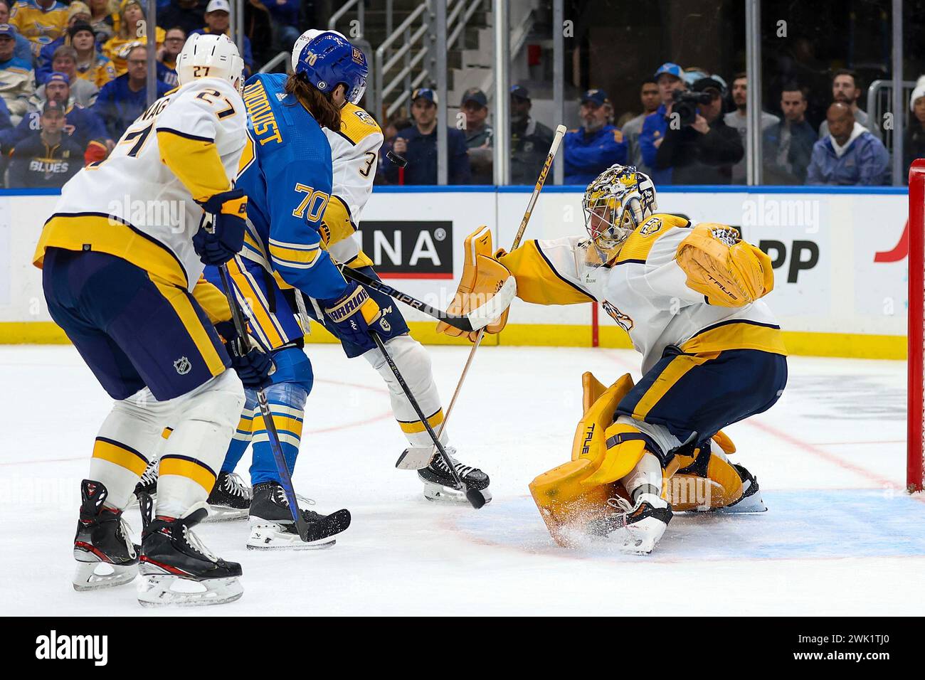 Nashville Predators goaltender Juuse Saros (74) deflects a shot by St ...