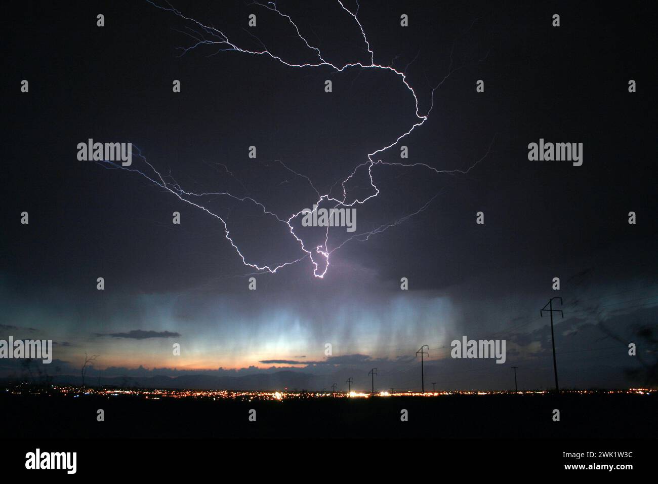 Lightning Bolt over Cityscape Desert Town Stock Photo - Alamy