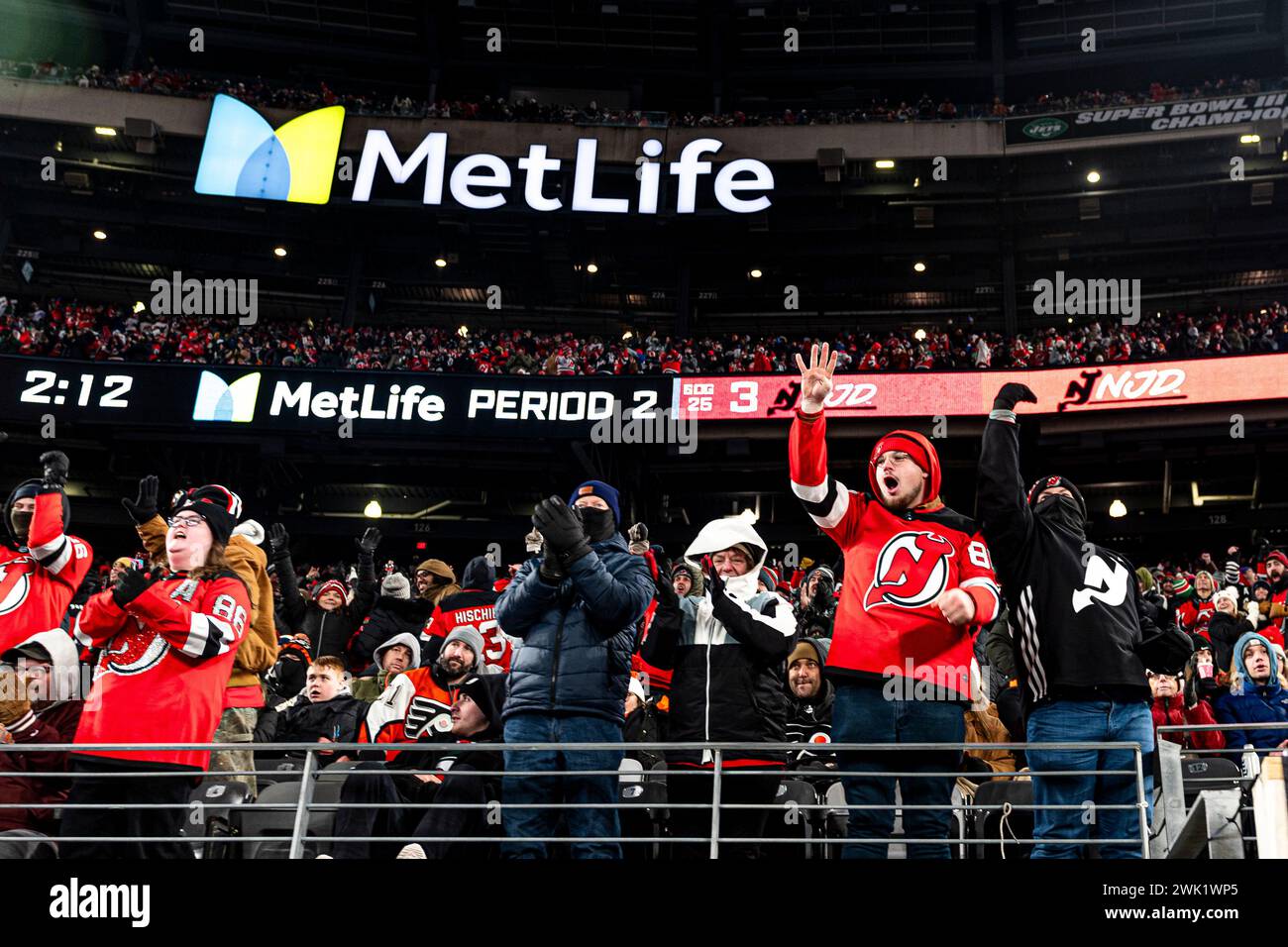 New Jersey Devils fans celebrate after the team scored in the second ...