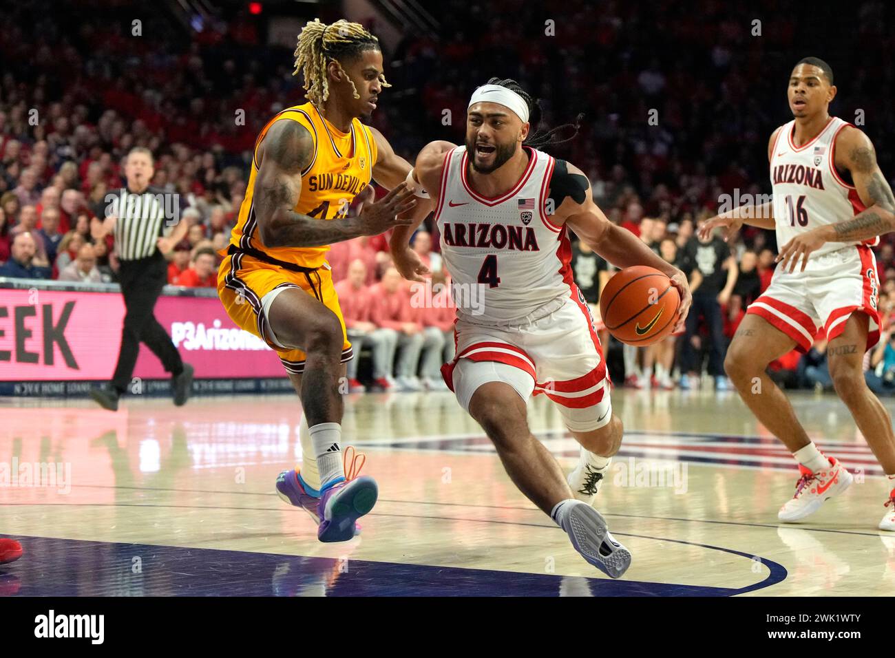 Arizona guard Kylan Boswell (4) drives past Arizona State guard Adam ...