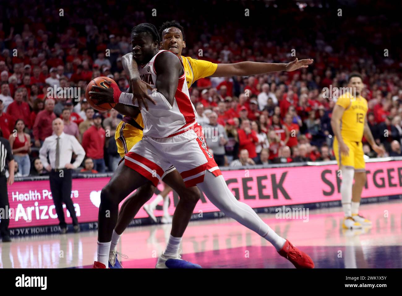 TUCSON, AZ - FEBRUARY 17 Arizona Wildcats center Oumar Ballo #11 gets ...