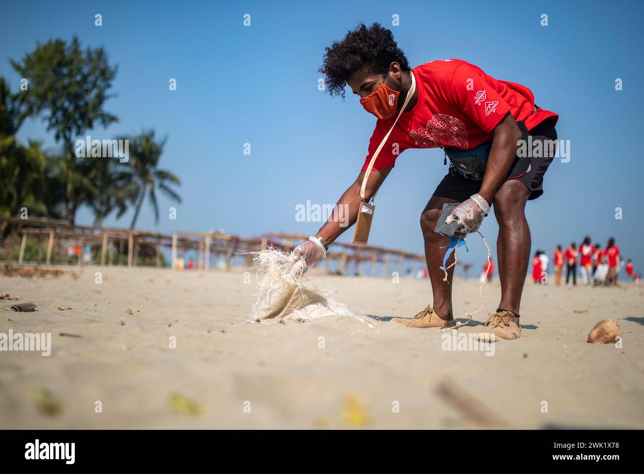 Volunteers clean up the Saint Martin's Island sea beach as a pert of ...