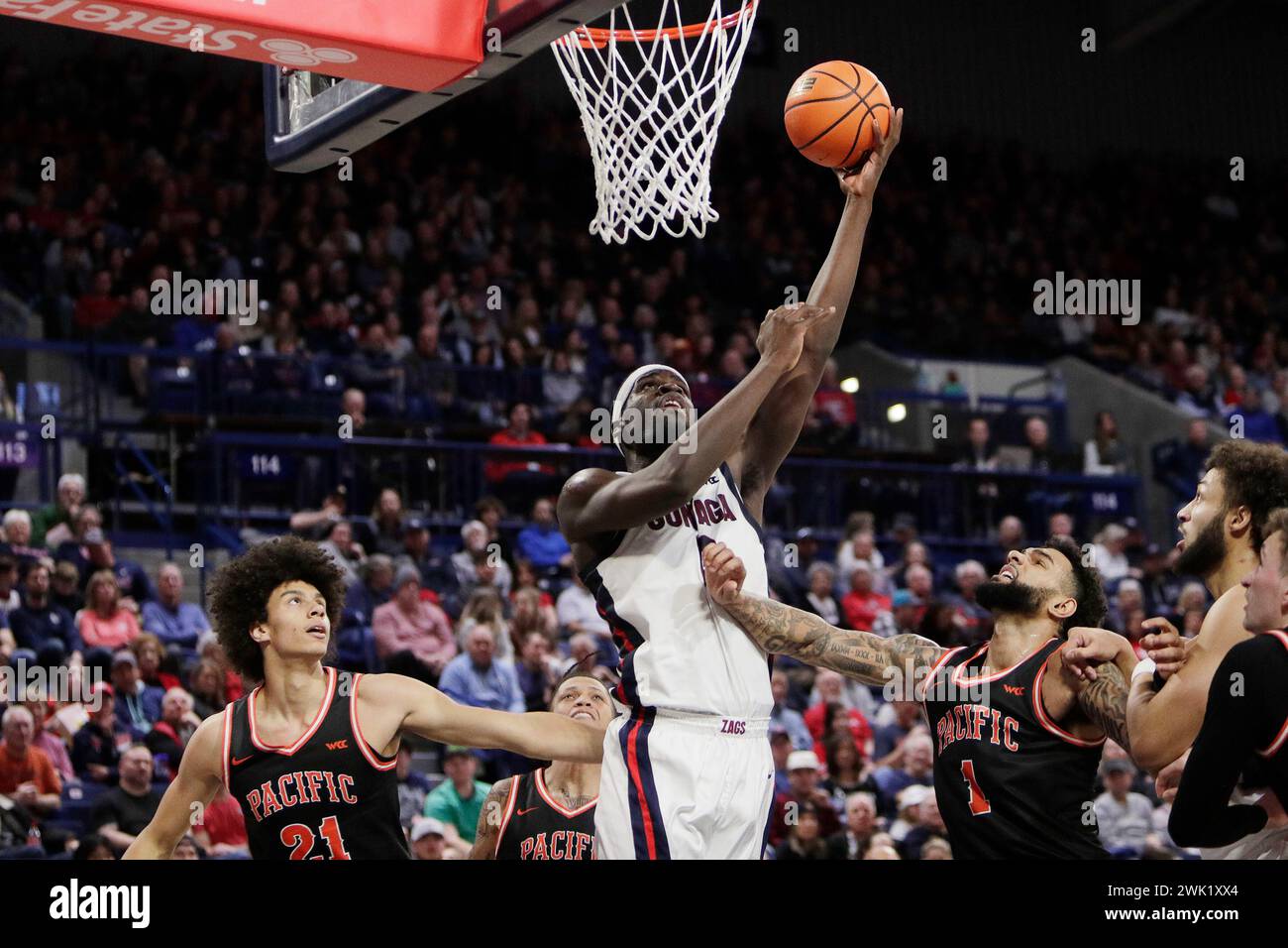 Gonzaga forward Graham Ike, center, shoots between Pacific guards ...