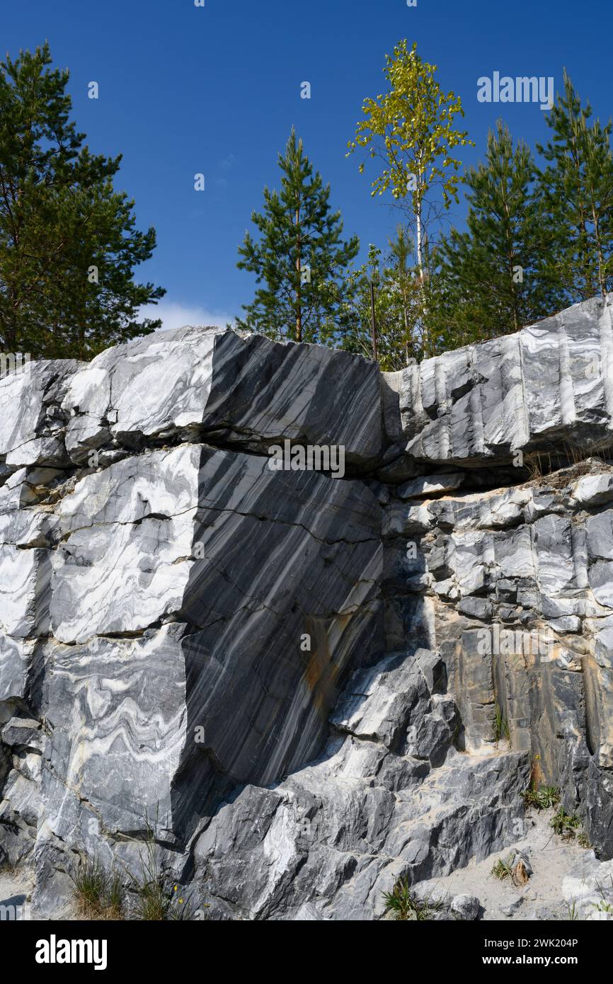Bizarre patterns of marble on huge stones in old quarries overgrown ...