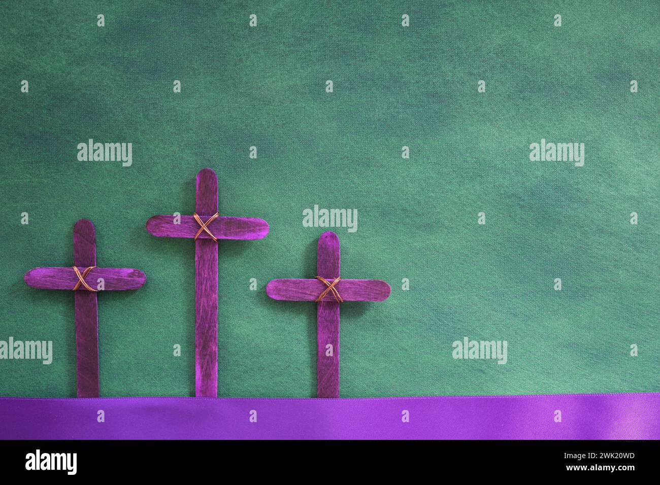 Three purple wooden cross in green background. Holy week and lent ...