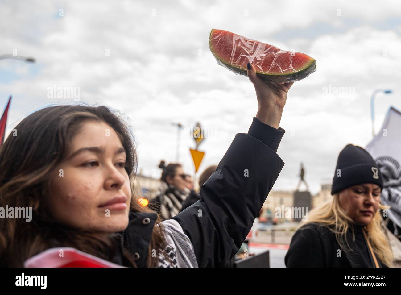 Warsaw, Poland. 17th Feb, 2024. A woman holds a watermelon as a symbol ...