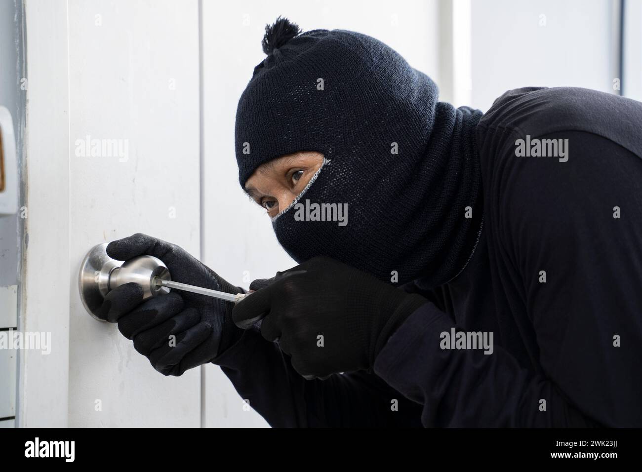 The villain was wearing black and had a screwdriver. Breaking the door ...