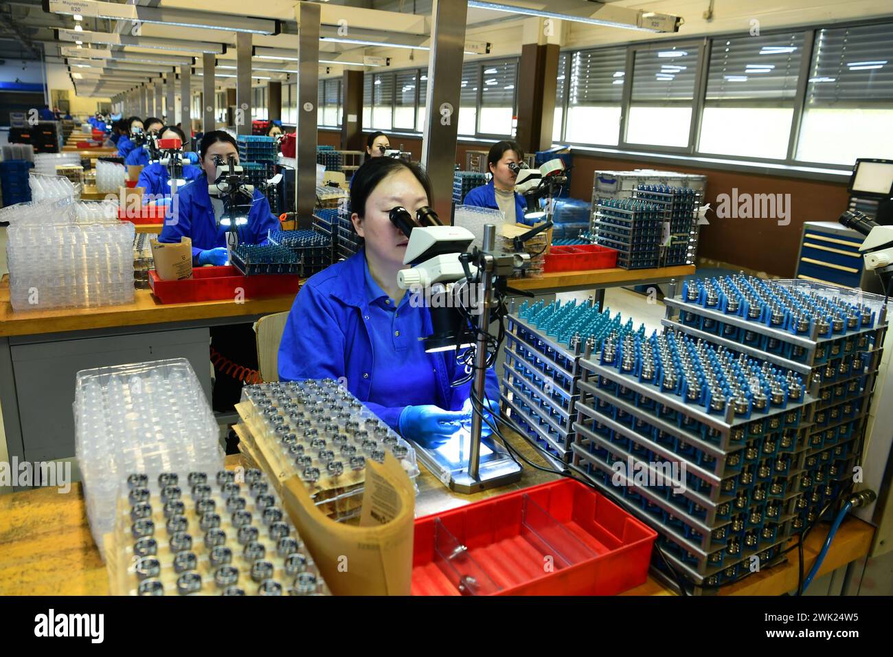 TAICANG, CHINA - FEBRUARY 18, 2024 - Employees inspect parts and ...