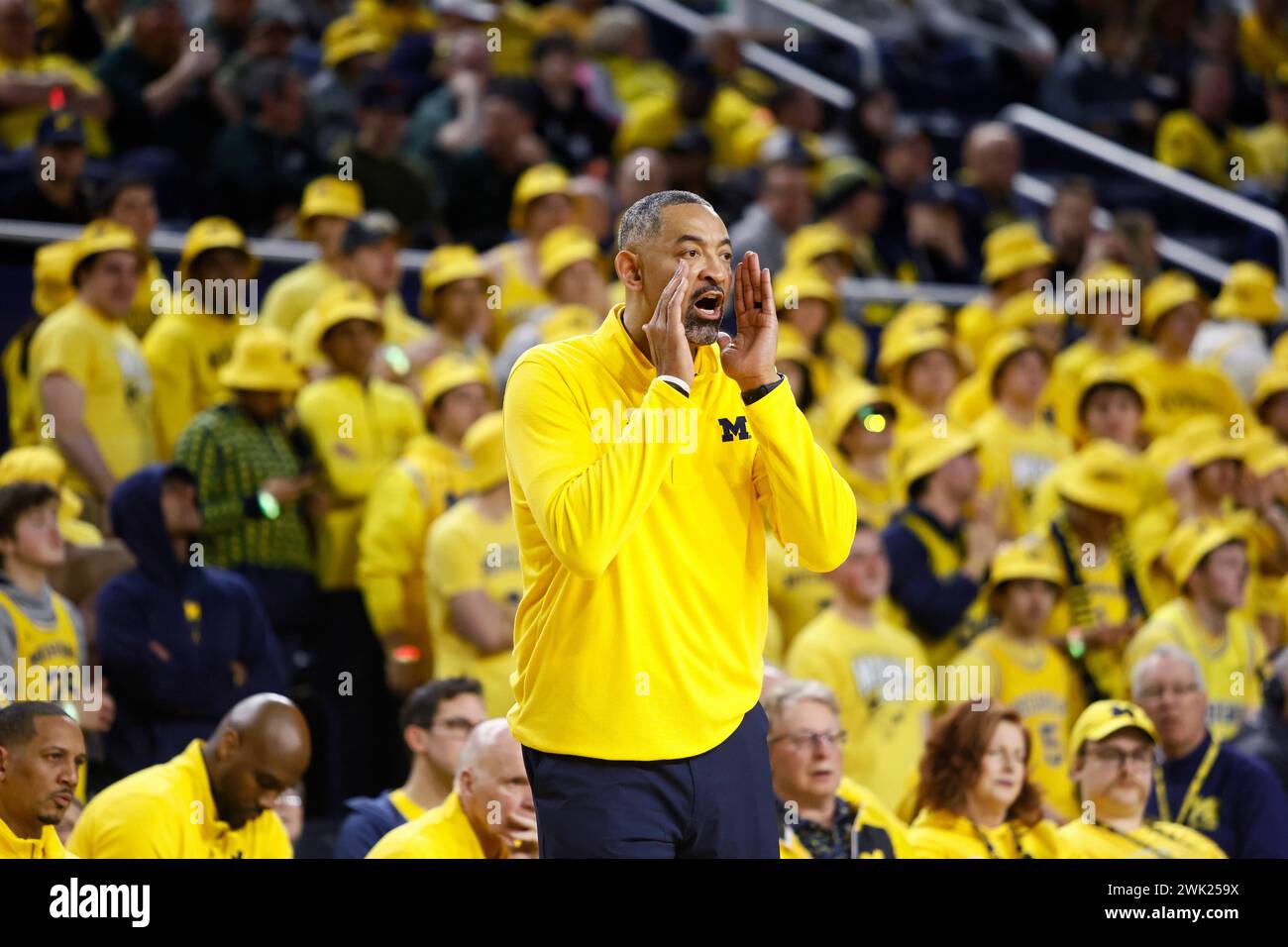 Michigan head coach Juwan Howard shouts to his team during the first ...
