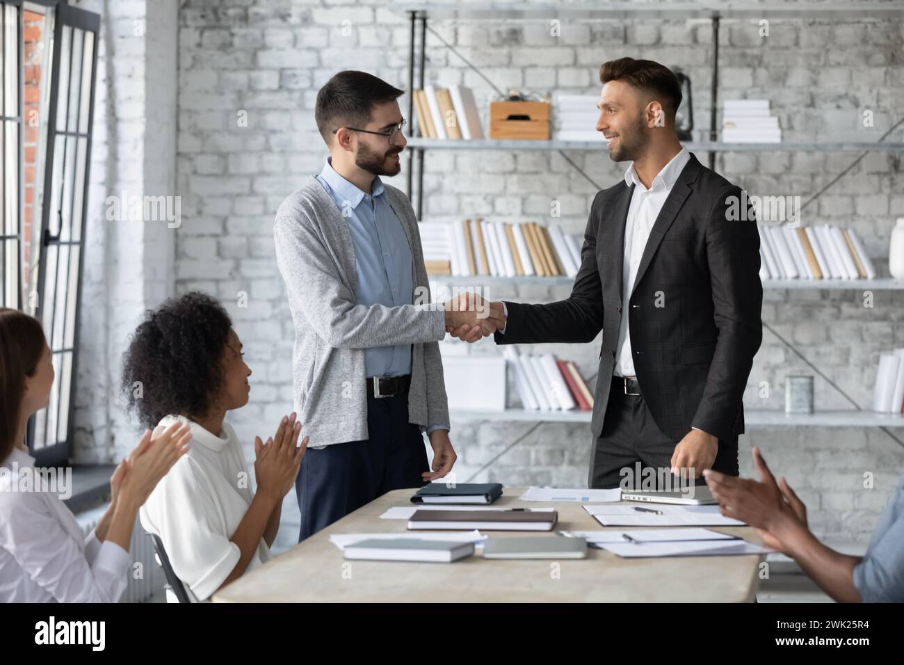 Happy CEO thanking employee for good work Stock Photo - Alamy