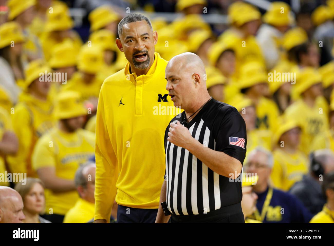Michigan head coach Juwan Howard talks to an official during the first ...