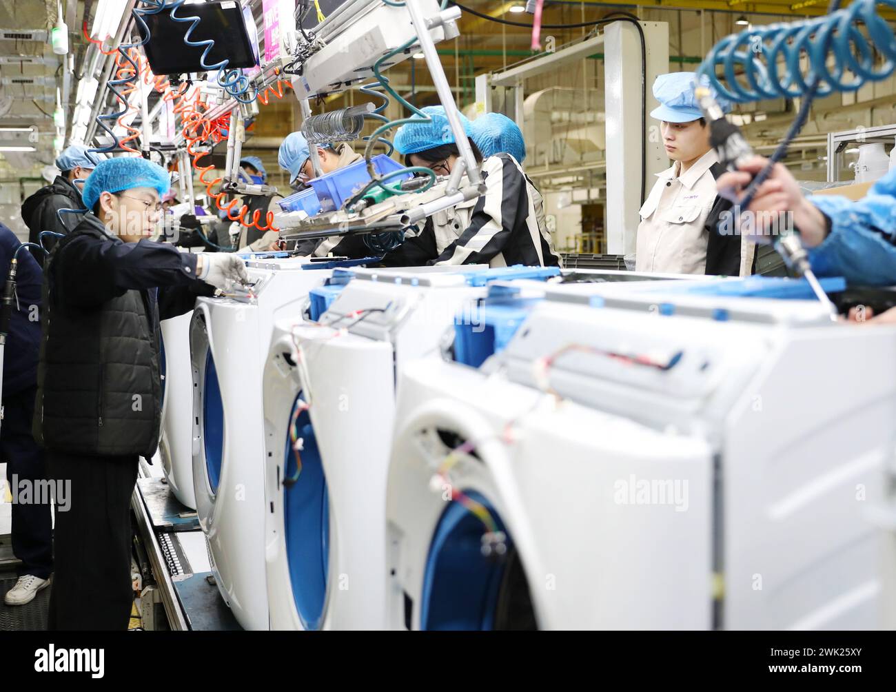 QINGDAO, CHINA - FEBRUARY 18, 2024 - Workers work on a production line ...