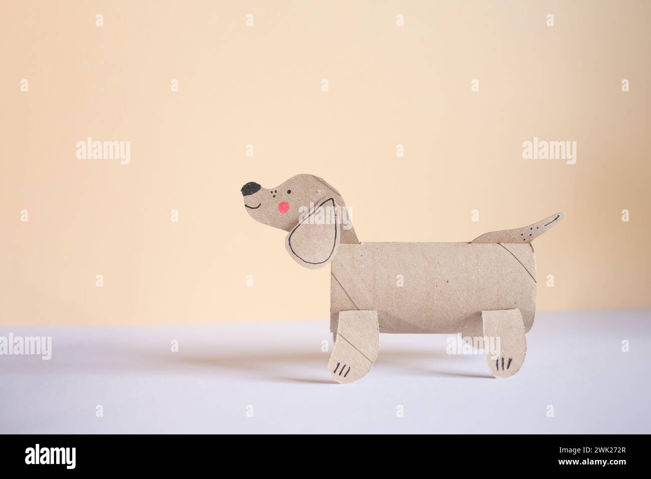 a dog made out of toilet paper roll, cut out of cardboard, dachshund ...