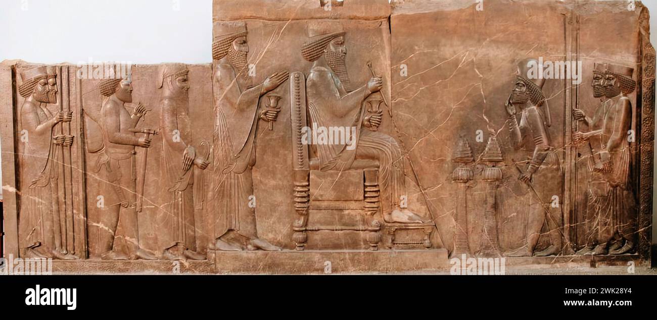 227. LIMESTONE RELIEF OF KING DARIUS SEATED ON THRONE, CROWN PRINCE ...