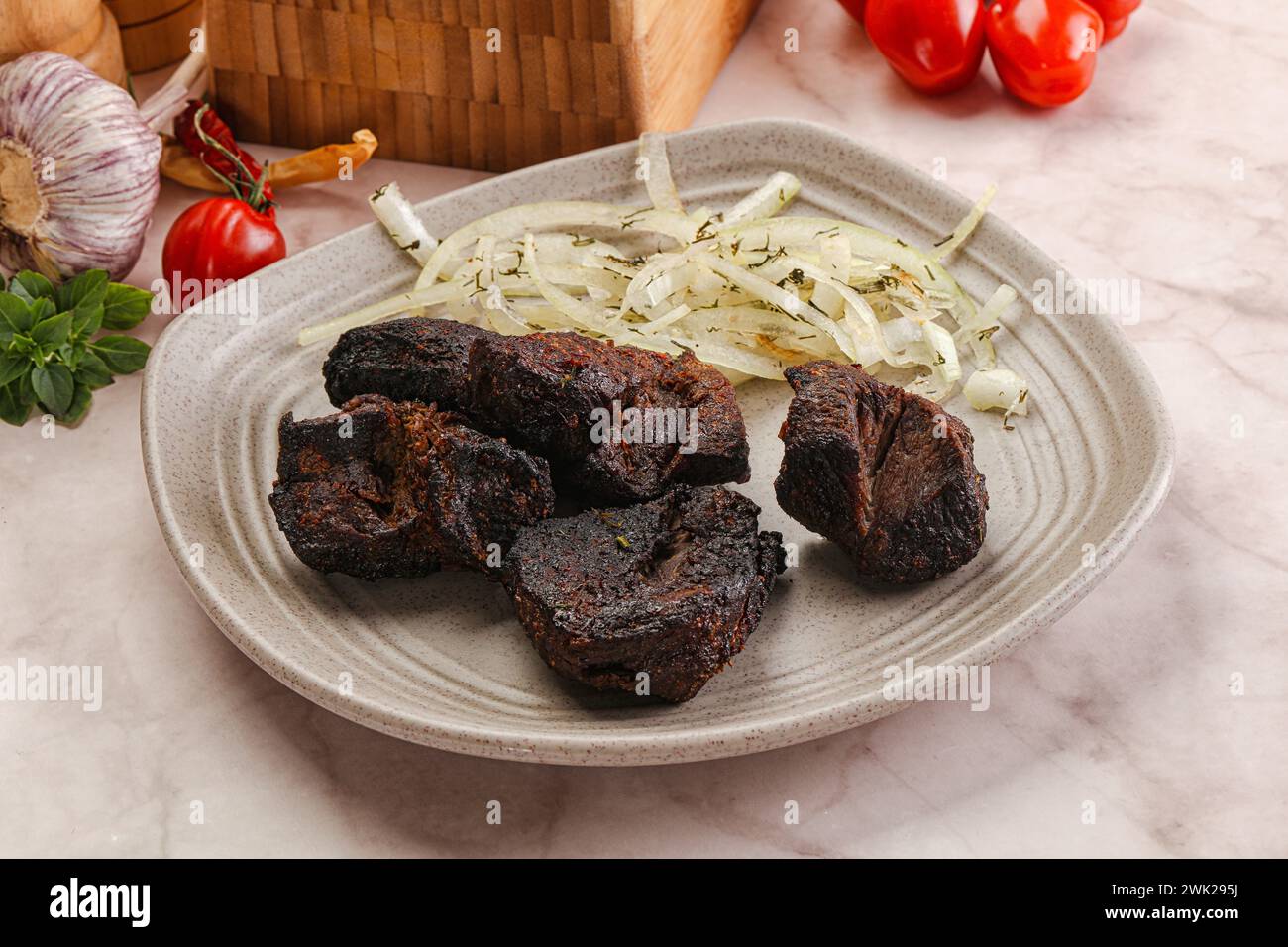 Grilled beef barbecue served onion rings Stock Photo - Alamy