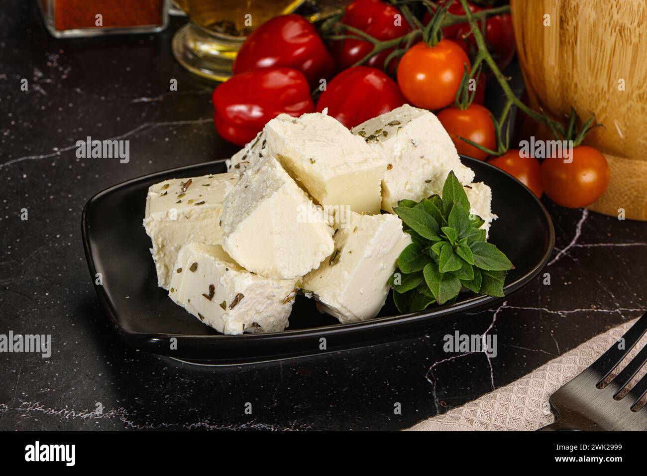 Greek traditional Feta cheese cubes with herbs and spices Stock Photo ...