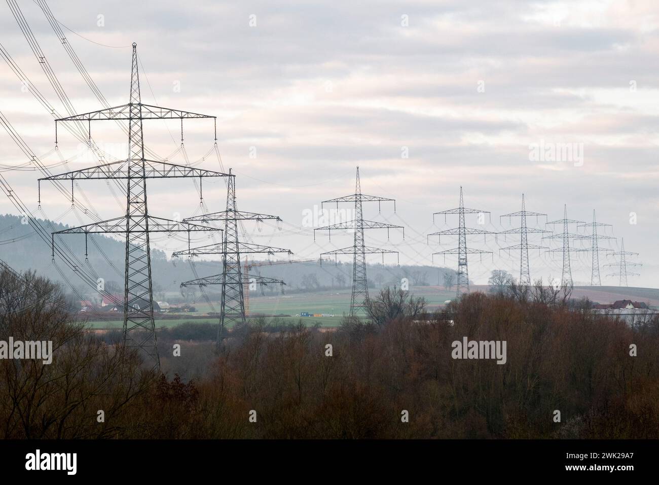 Redwitz, Germany. 18th Feb, 2024. Electricity pylons at dawn. They are ...