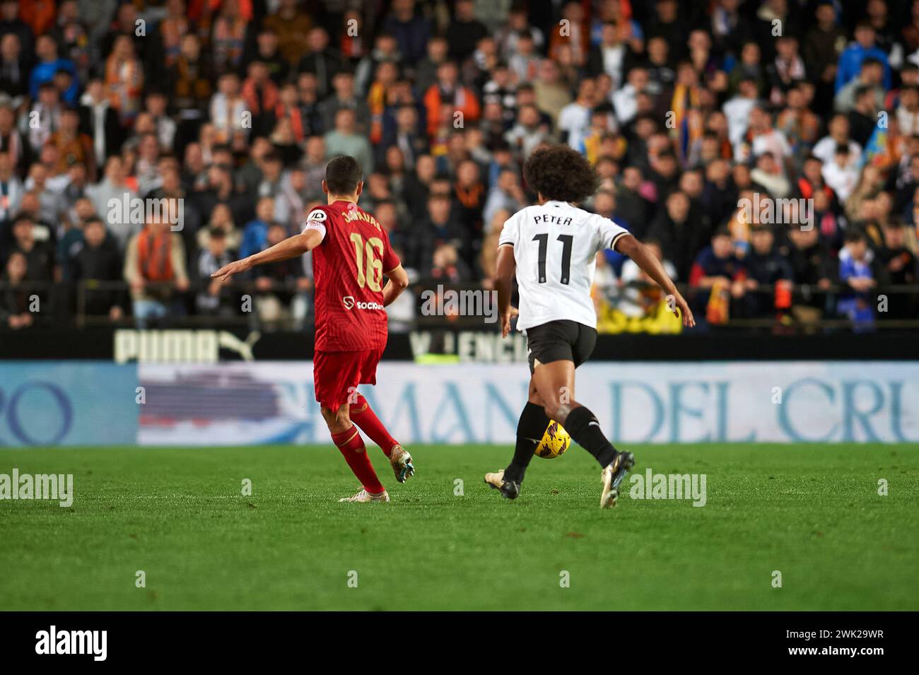 Jesus Navas of Sevilla FC, Peter Gonzalez of Valencia CF in action ...