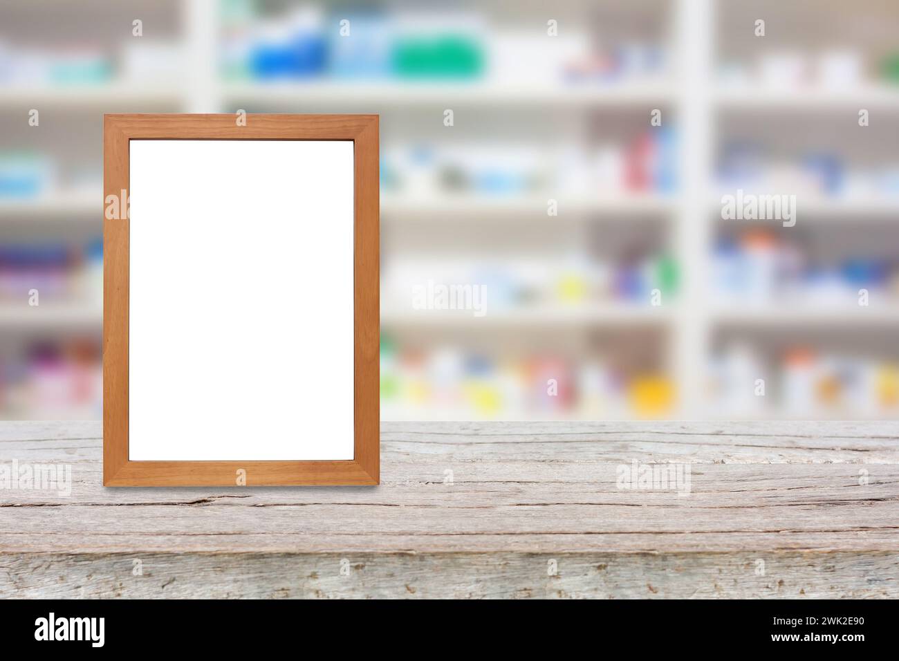 wood photo frame on the pharmacy counter over blur shelves of drug in ...