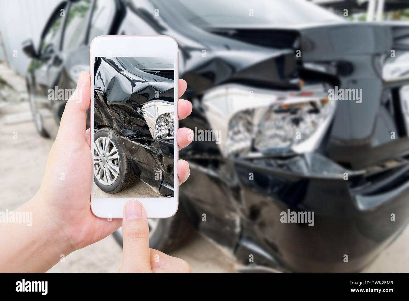 female hold mobile smartphone photographing car accident for insurance ...
