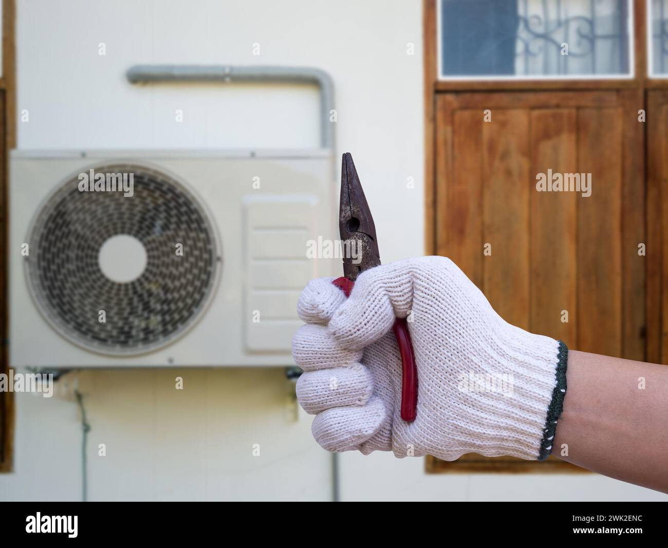 technician installing outdoor air conditioning unit Stock Photo - Alamy