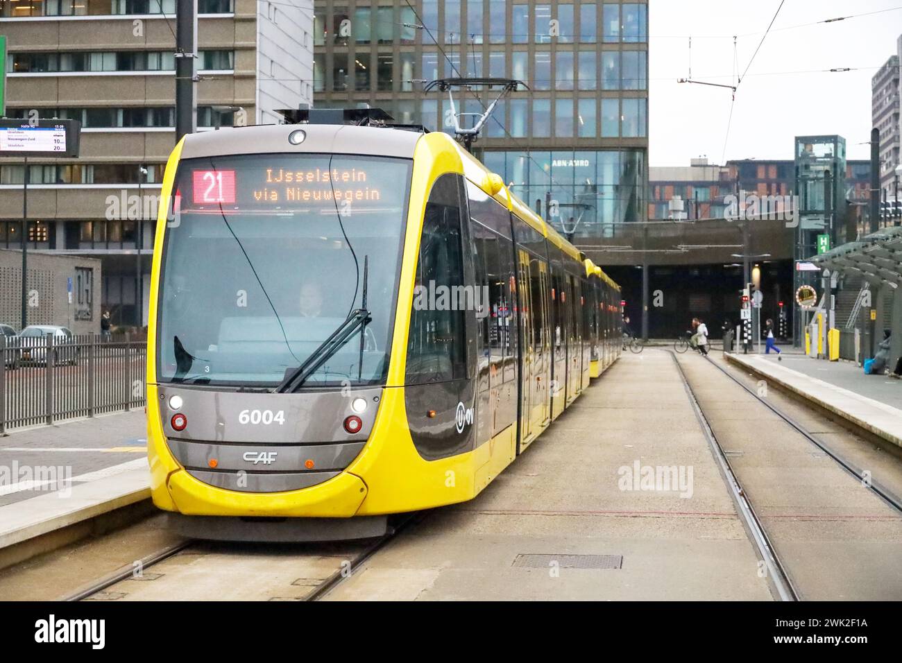 Yellow CAF Urbos trams on the streets of utrecht to connect to commuter ...
