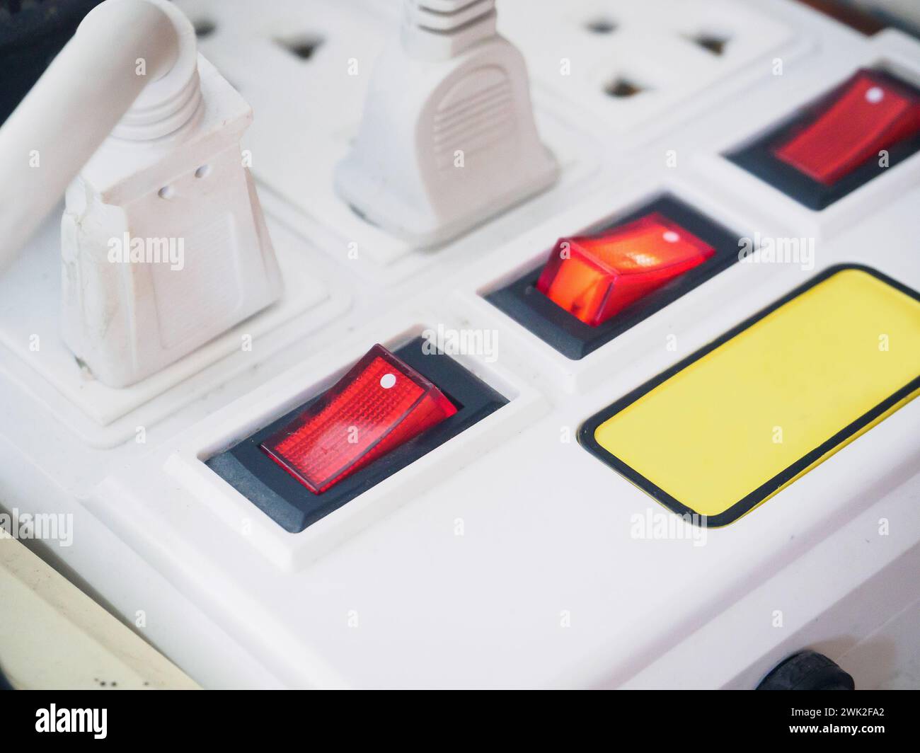 Multiple power socket with connected plugs Stock Photo - Alamy