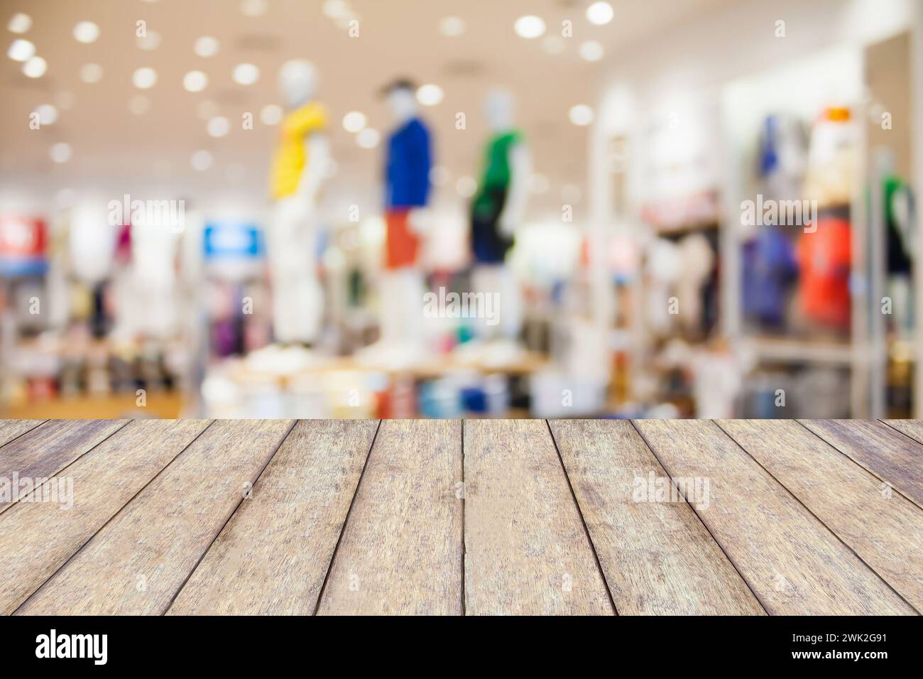 Empty table and blur clothing store with bokeh background, product ...