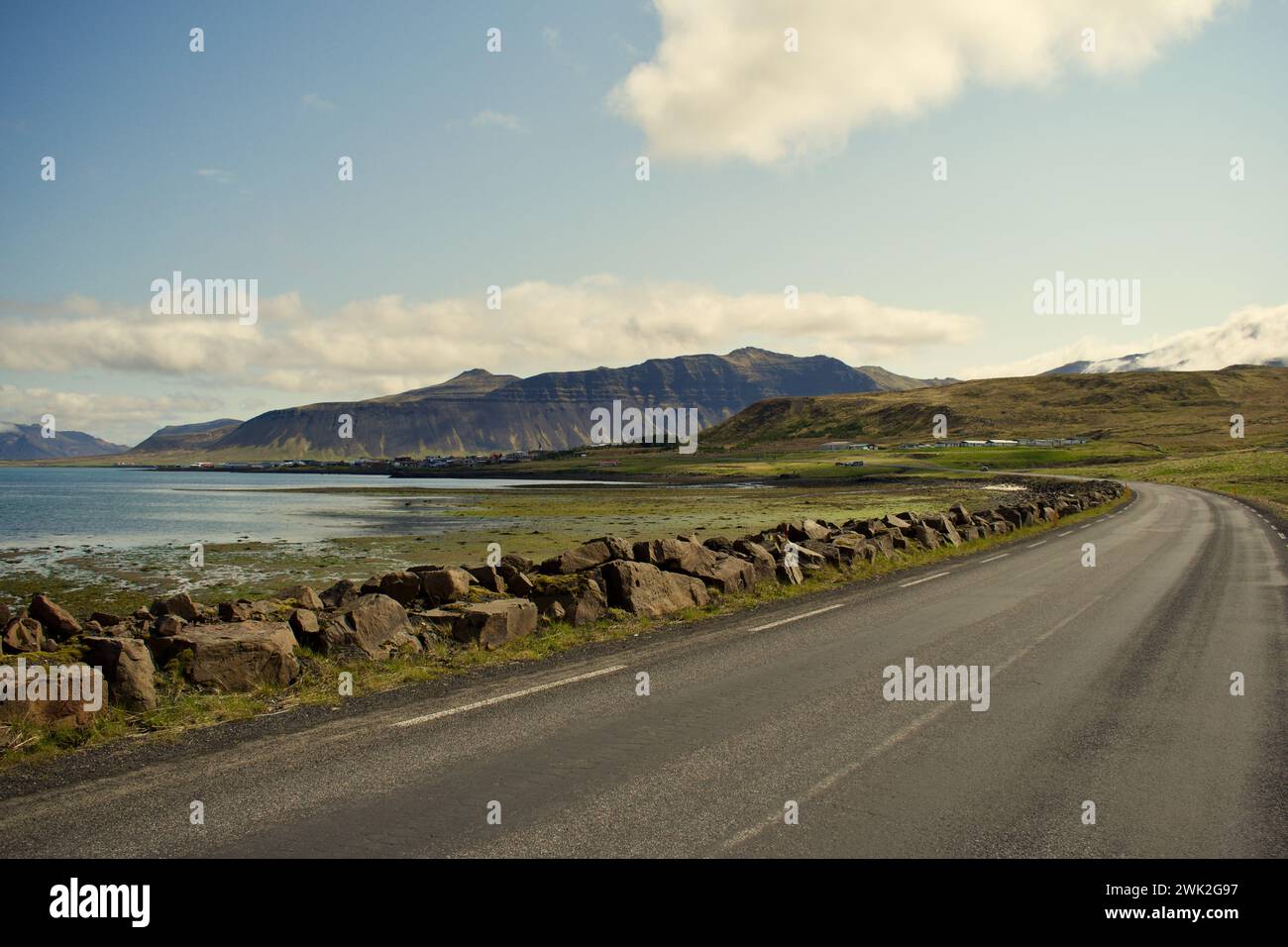 Black sand beach with rocks and reflexes in ring road in Iceland with ...
