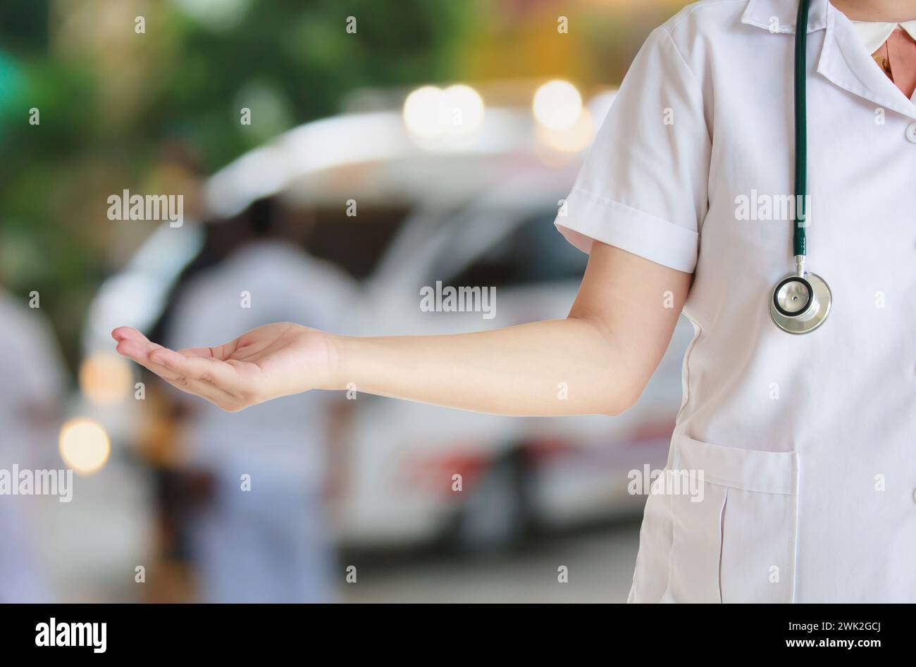 female doctor with ambulance responding to emergency call blurred ...