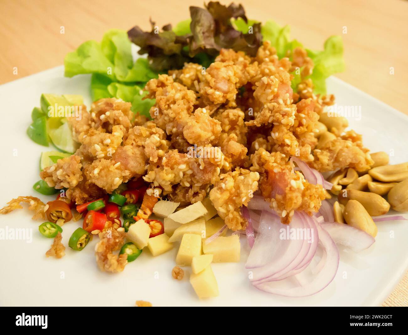 fermented chicken tendons fried, thai food Stock Photo - Alamy