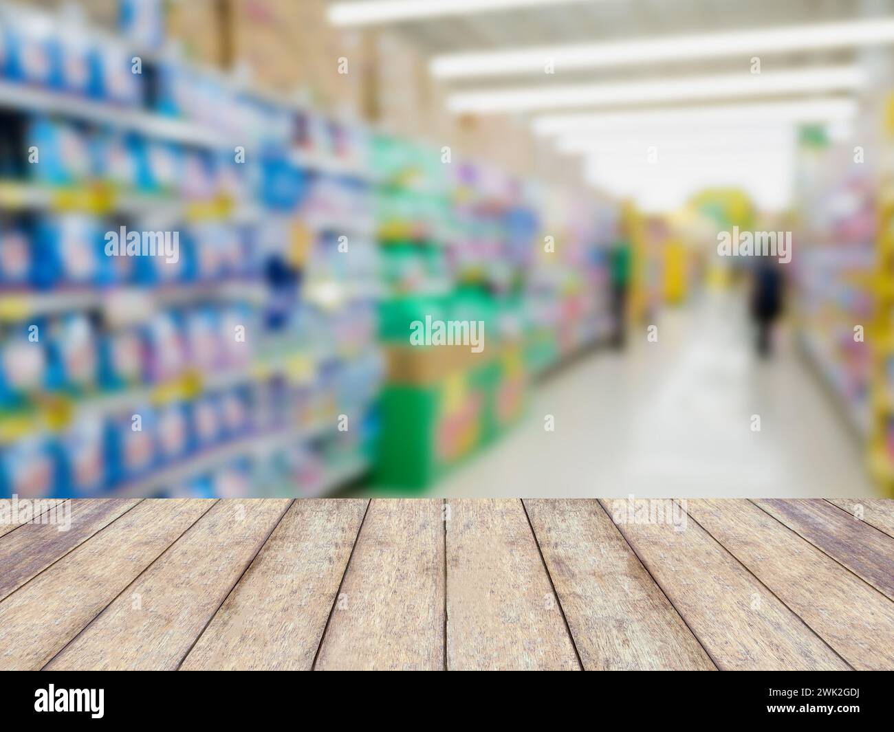 wood table top with detergent shelves in laundry section in supermarket ...