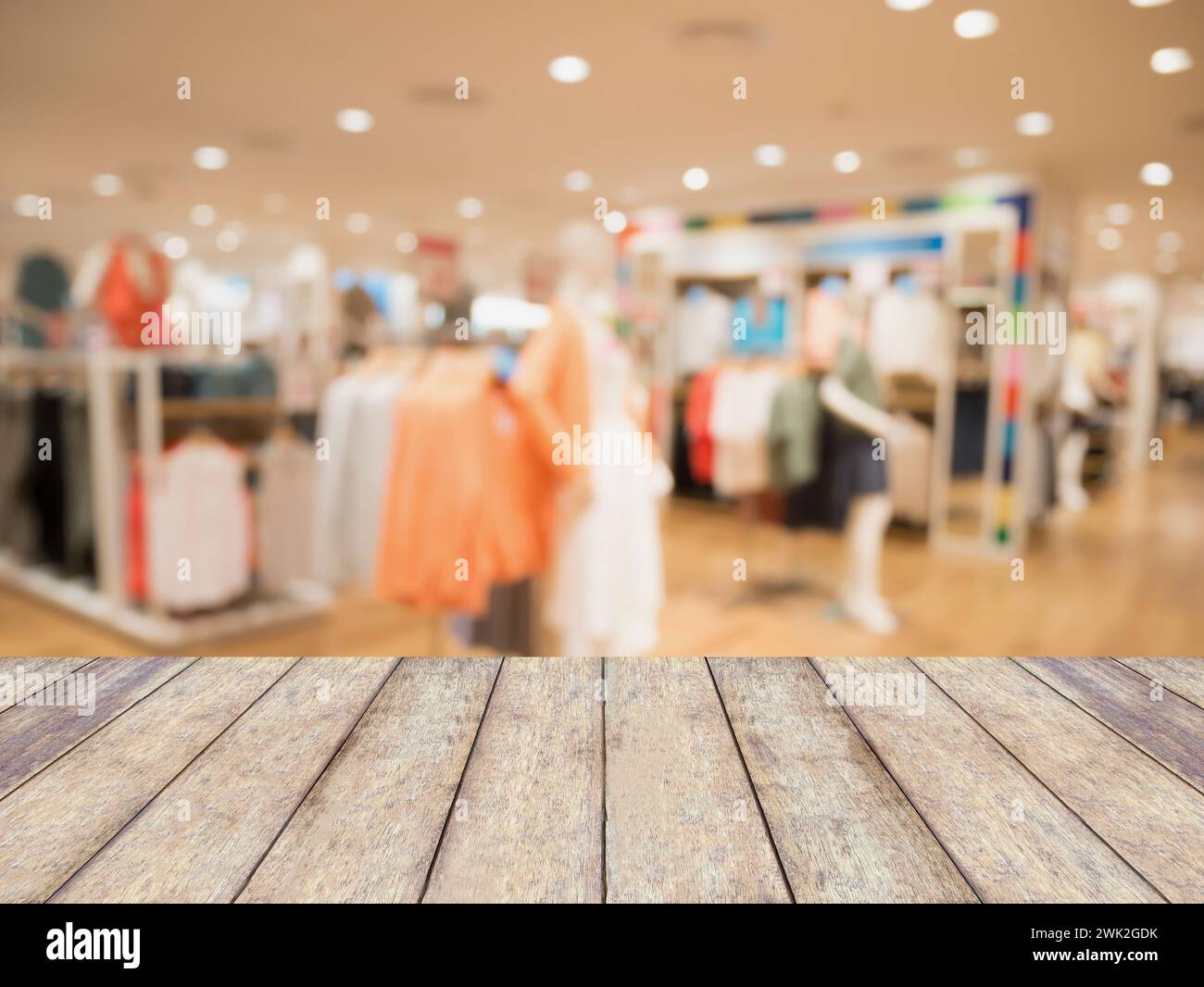 wood table with blur clothing store background in shopping mall Stock ...