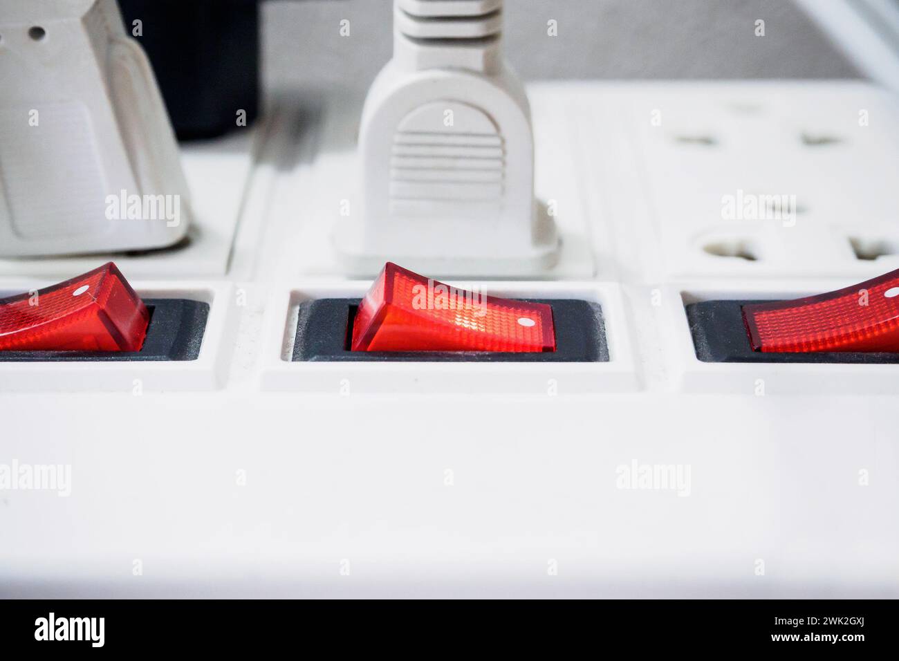 Multiple power socket with connected plugs Stock Photo - Alamy