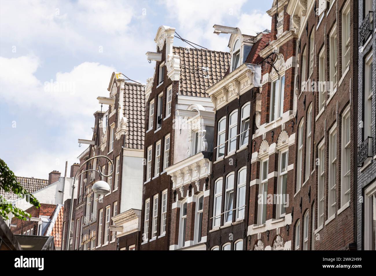 Historic canal houses with different facades in the center of Amsterdam ...