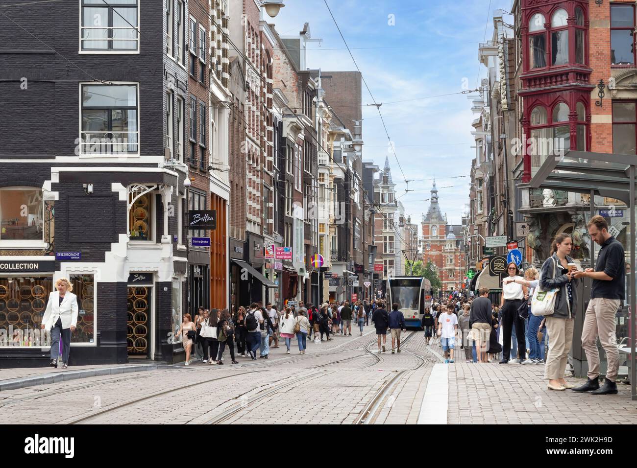Leidsestraat - famous shopping street with pedestrians, tourists and trams in the center of ...