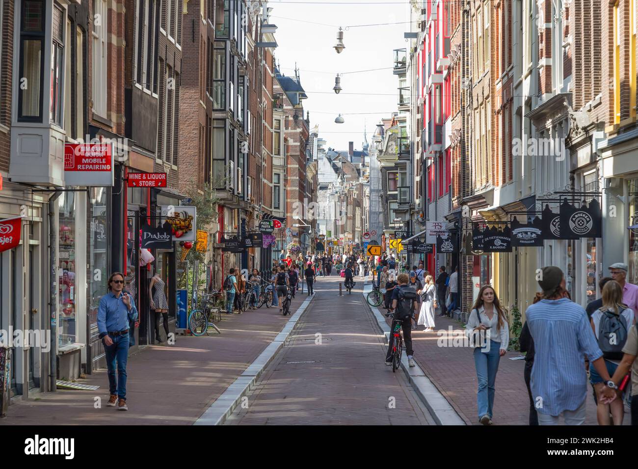 Cozy narrow shopping street with many small shops and boutiques in the ...